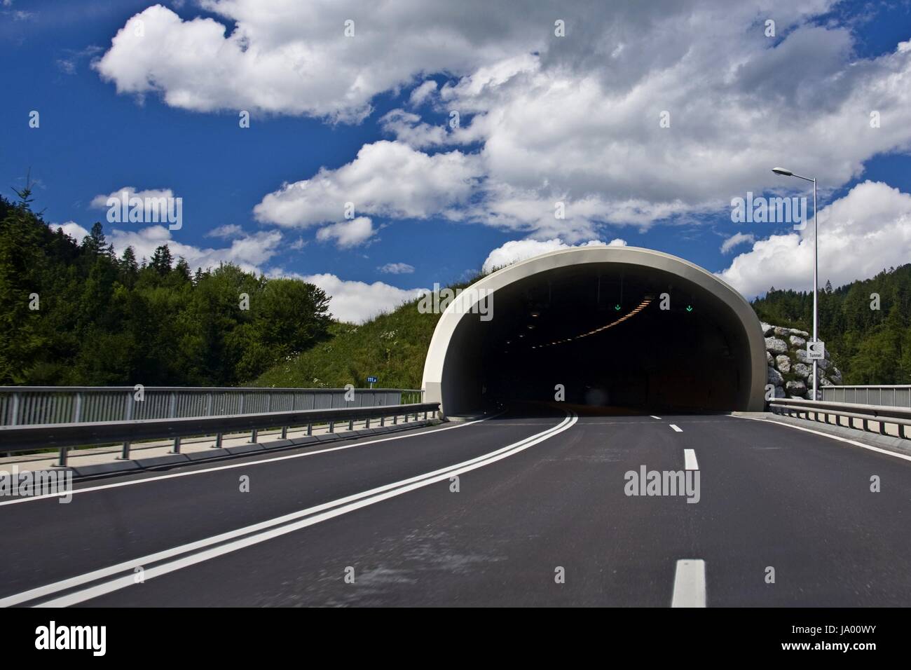Road going directly to tunnel Stock Photo - Alamy