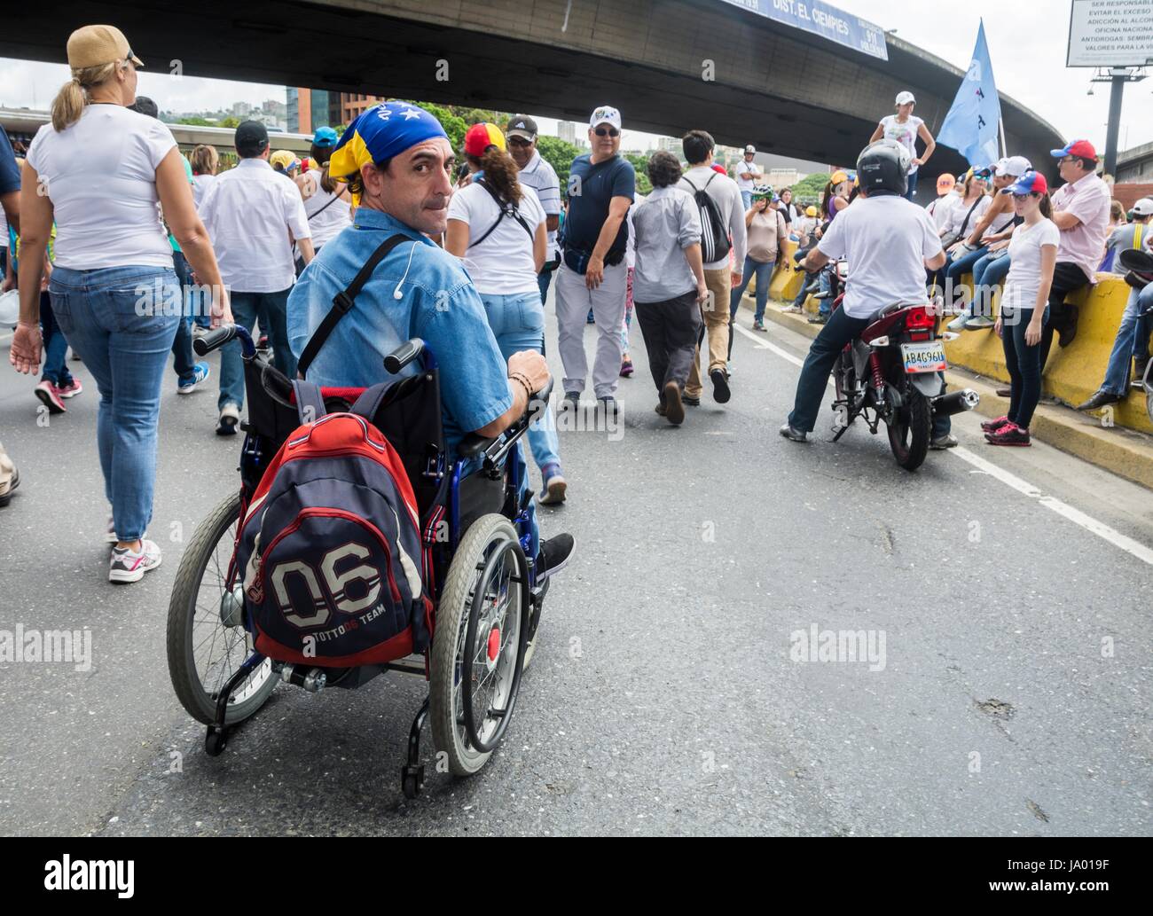 A young man in a wheelchair protests on the freeway. The Bureau of ...
