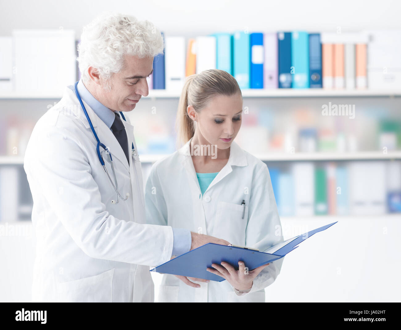 Secretary checking in hospital hi-res stock photography and images - Alamy
