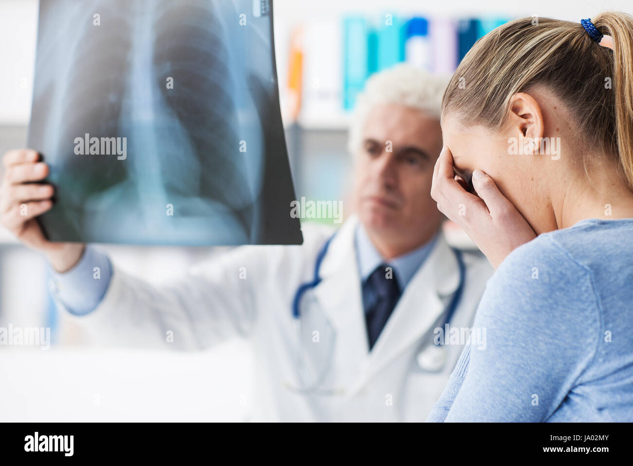 Sad woman having a consultation at doctor's office, the doctor is ...