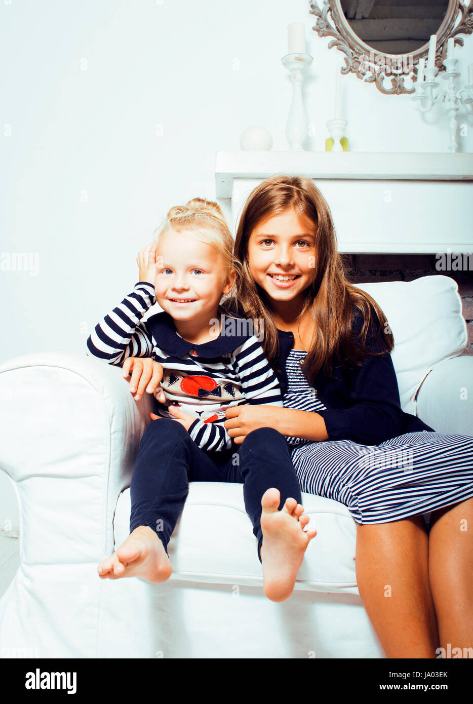 two cute sisters at home interior playing, little happy smiling Stock ...