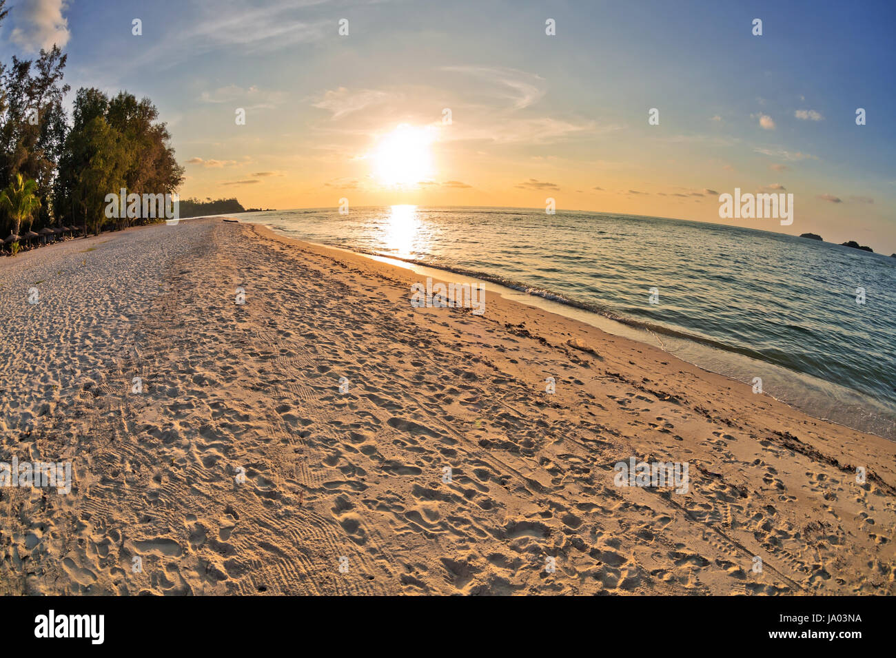 Tropical beach at beautiful sunset in fish-eye lense. Nature background ...