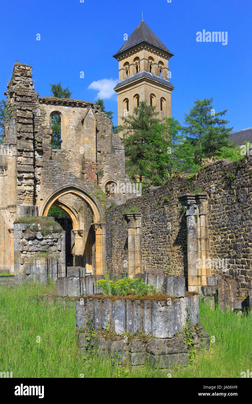 The bell-tower of Orval Church (1948) amidst the 12th-century ruins of ...