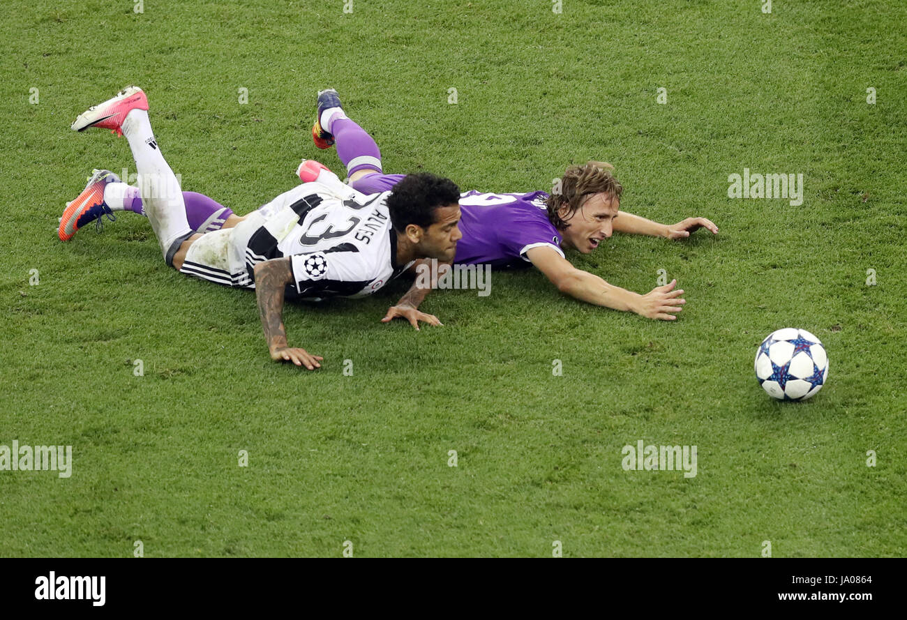 Juventus' Dani Alves and Real Madrid's Luka Modric go to ground during ...