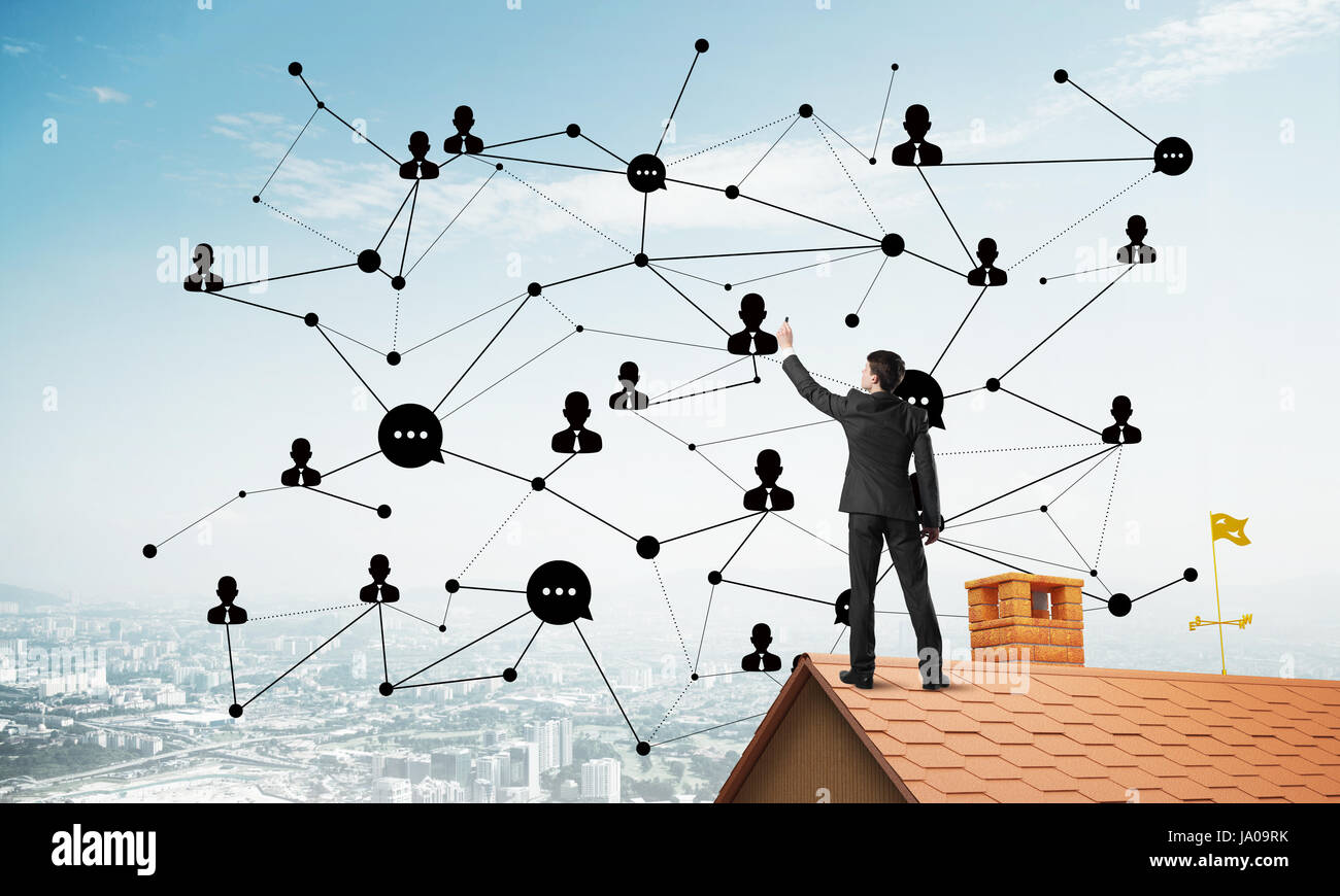 Businessman on house roof presenting networking and connection concept ...