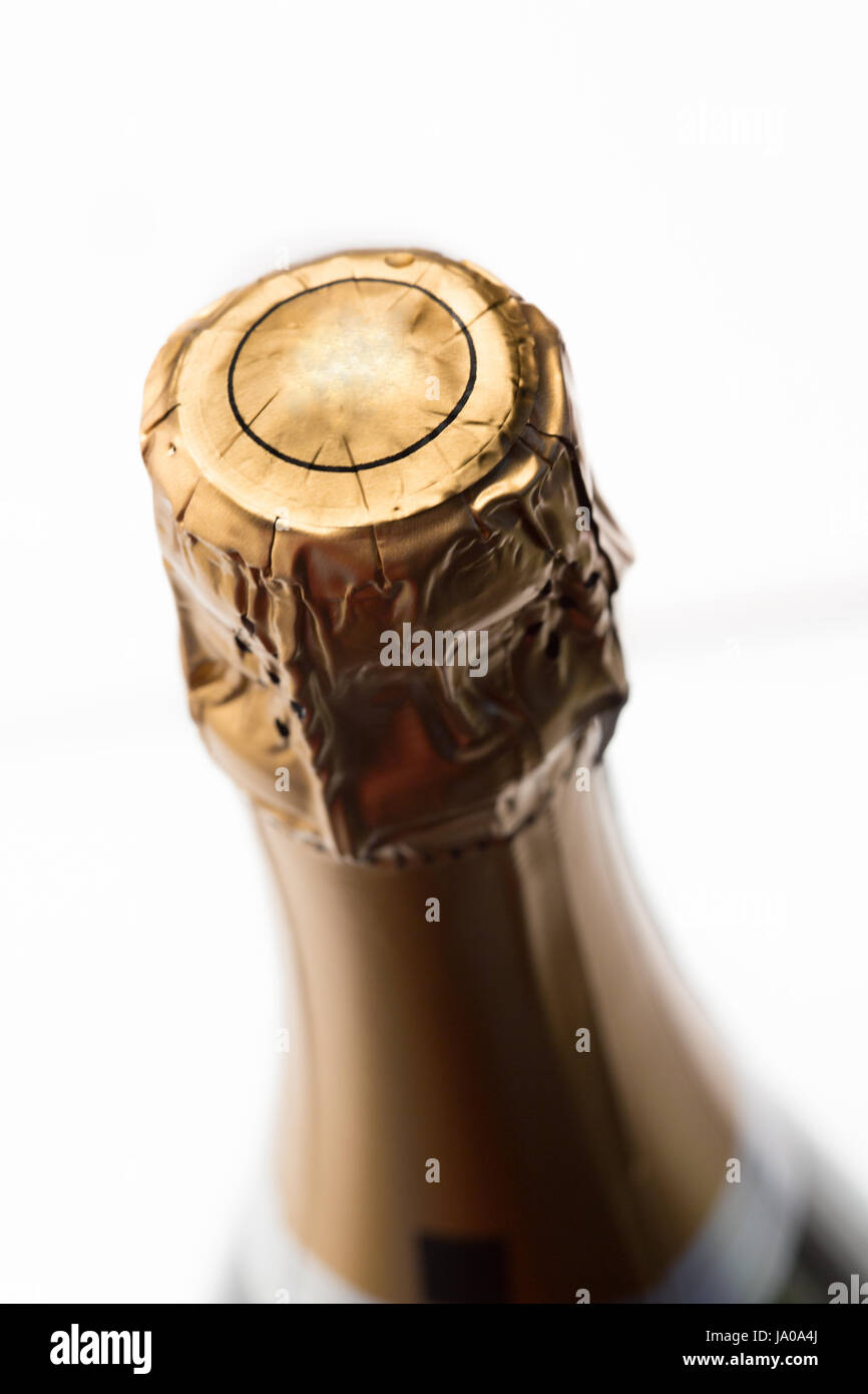 Close up of top of champagne bottle on white background Stock Photo - Alamy