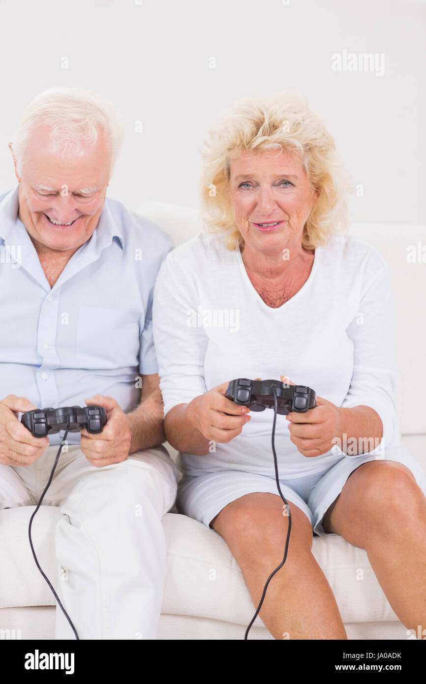 Old couple playing video games hi-res stock photography and images - Alamy