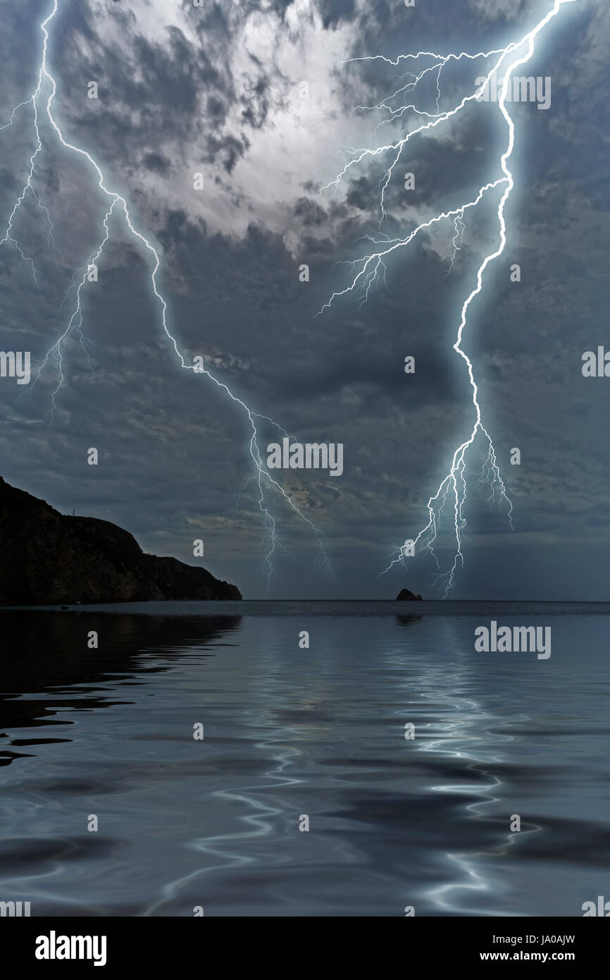 lightning over the ocean with dramatic sky Stock Photo - Alamy