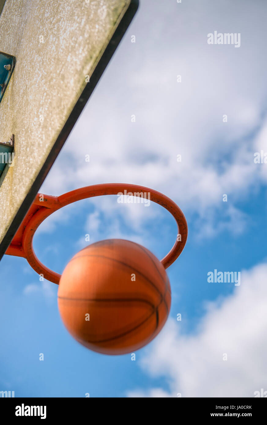 Basketball going through a hoop Stock Photo - Alamy