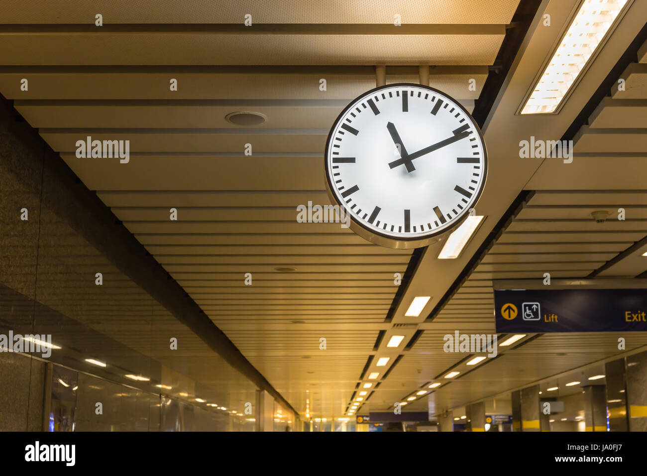 Public big white clock In a railway station Stock Photo - Alamy