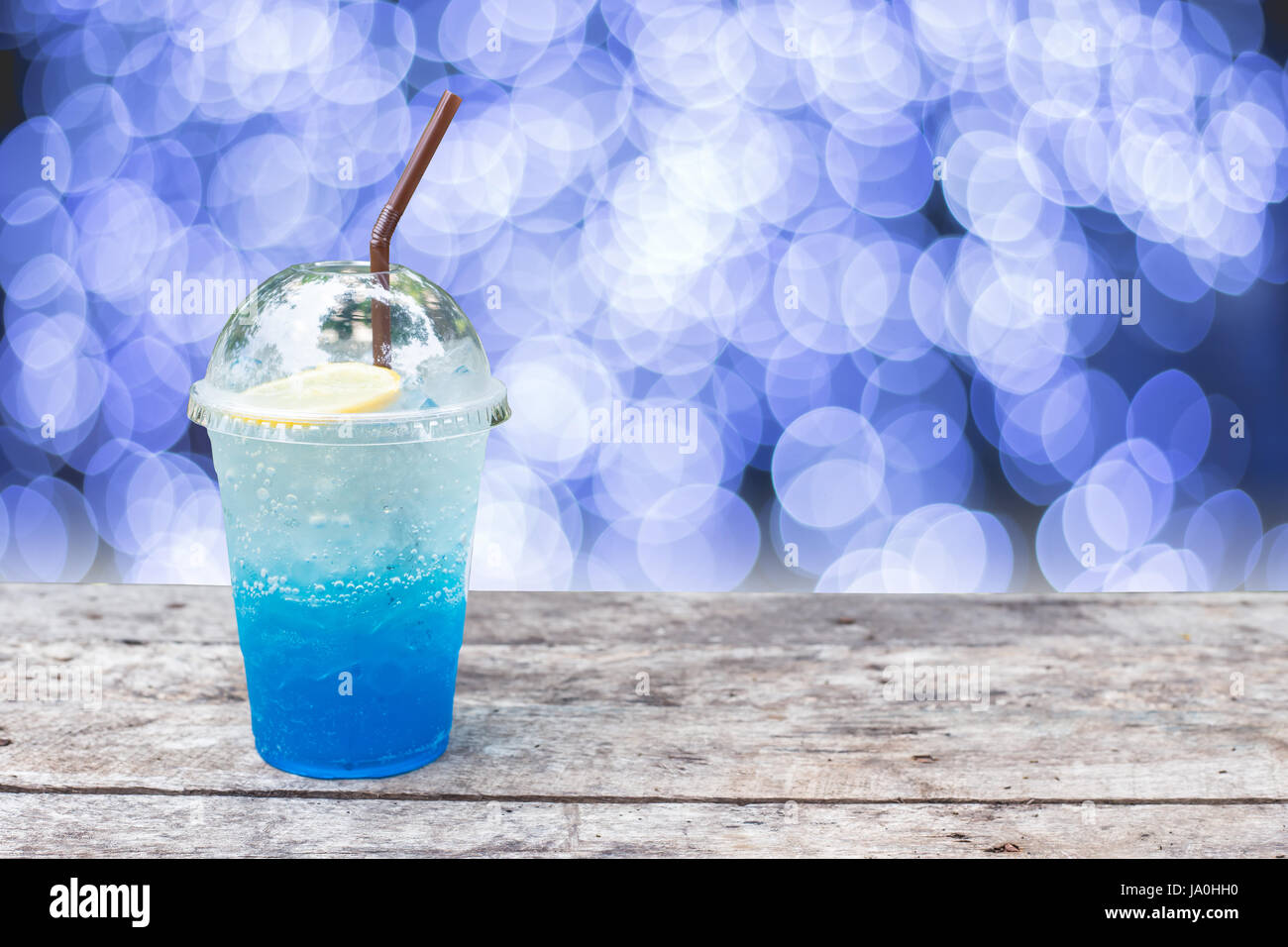 blue lemon soda on wooden table with abstract bokeh background Stock ...