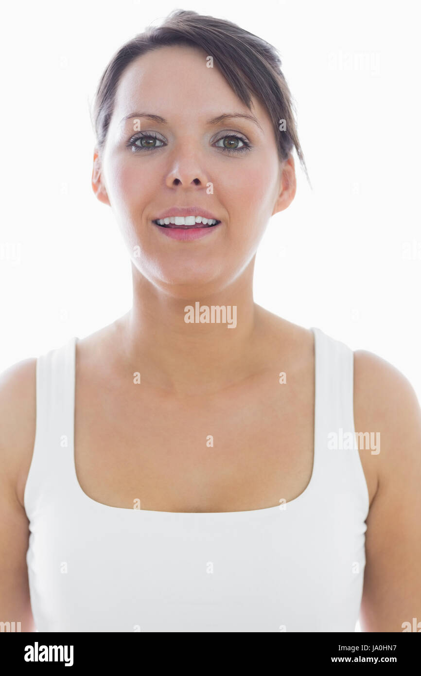 Closeup portrait of an attractive young woman in tank top over white ...