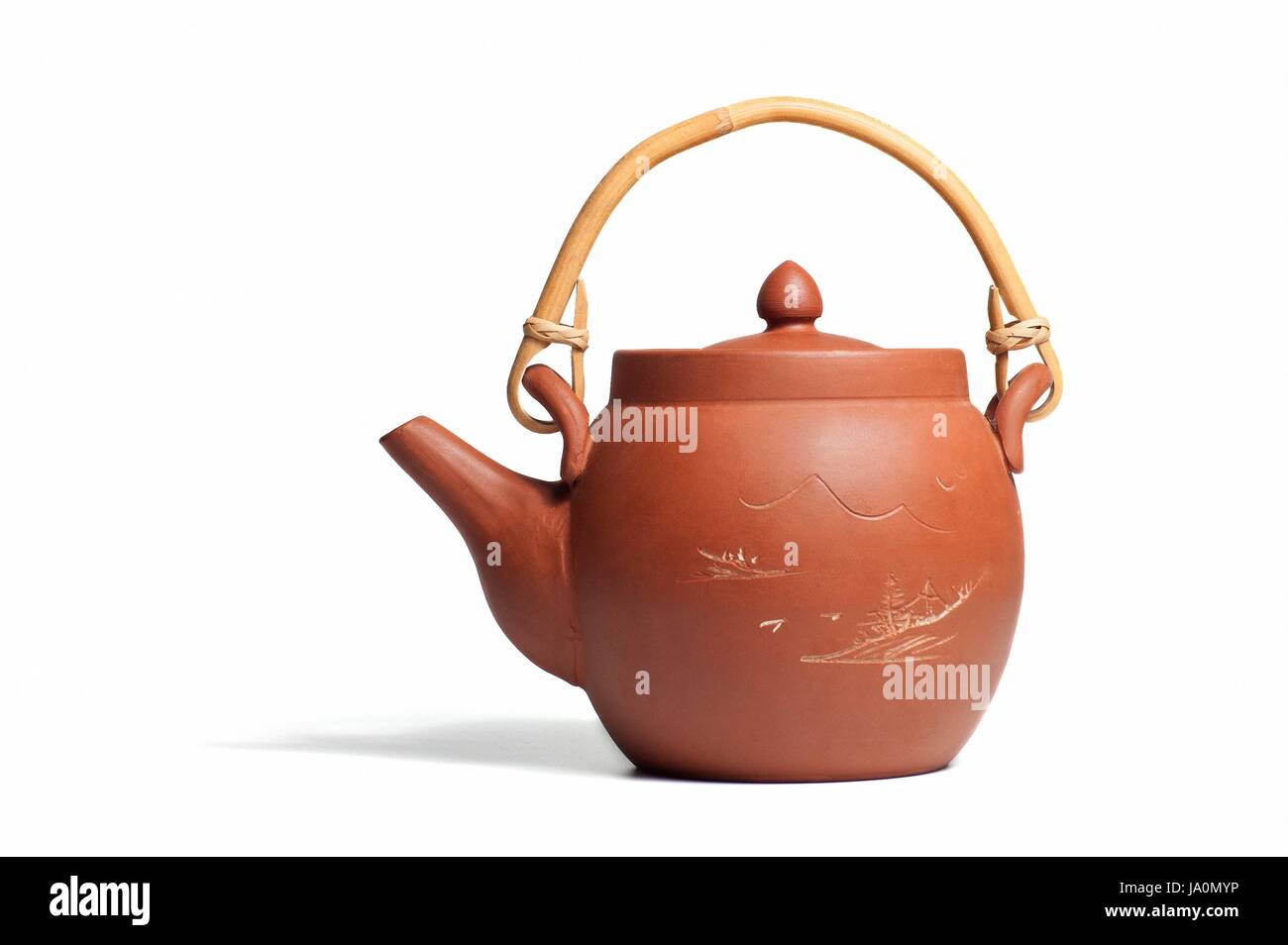 The chinese clay teapot isolated on the white background with shadow ...
