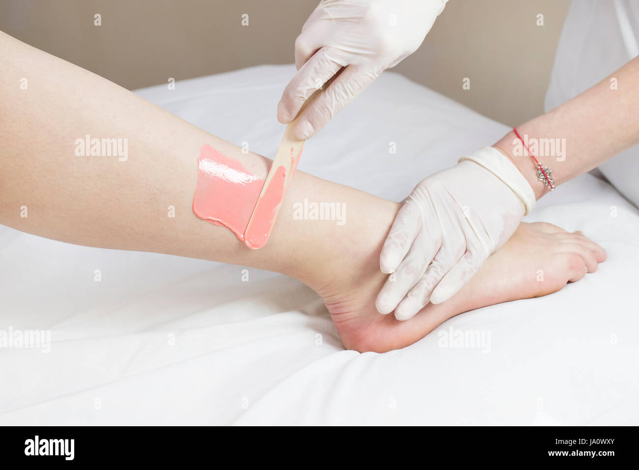 Process depilation female legs and hands in a beauty salon Stock Photo ...