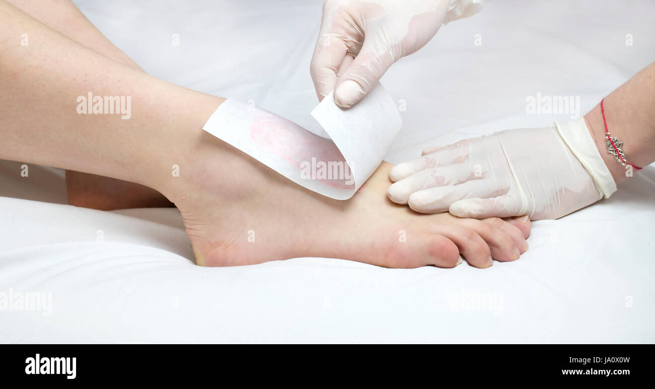 Process depilation female legs and hands in a beauty salon Stock Photo ...