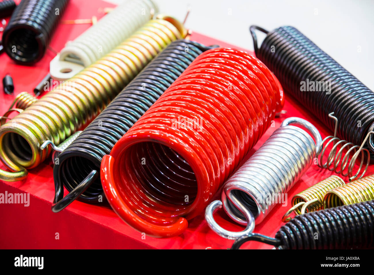 Multicolored metal of different sizes car springs Stock Photo - Alamy