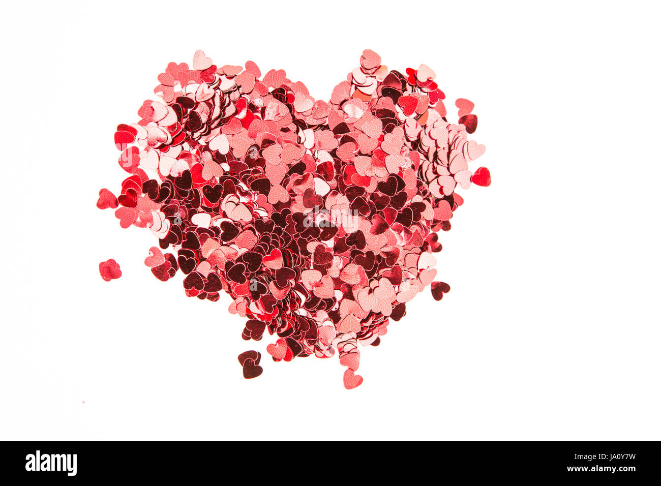 Valentines confetti on white background Stock Photo - Alamy