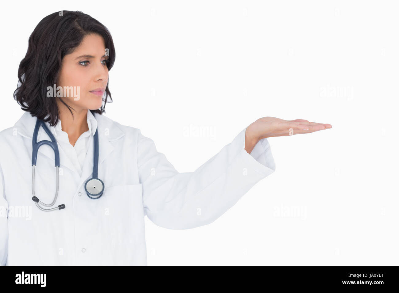 Doctor waiting to receive on white background Stock Photo - Alamy