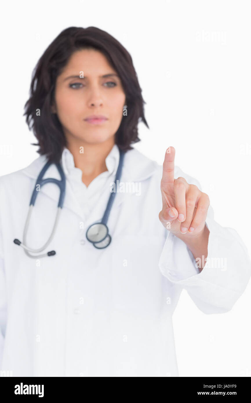 Doctor pointing the finger in the air on white background Stock Photo ...