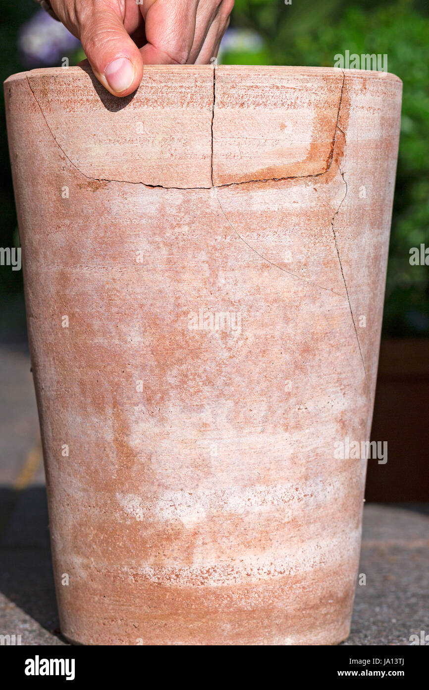 glue together pieces of a clay pot break Stock Photo - Alamy