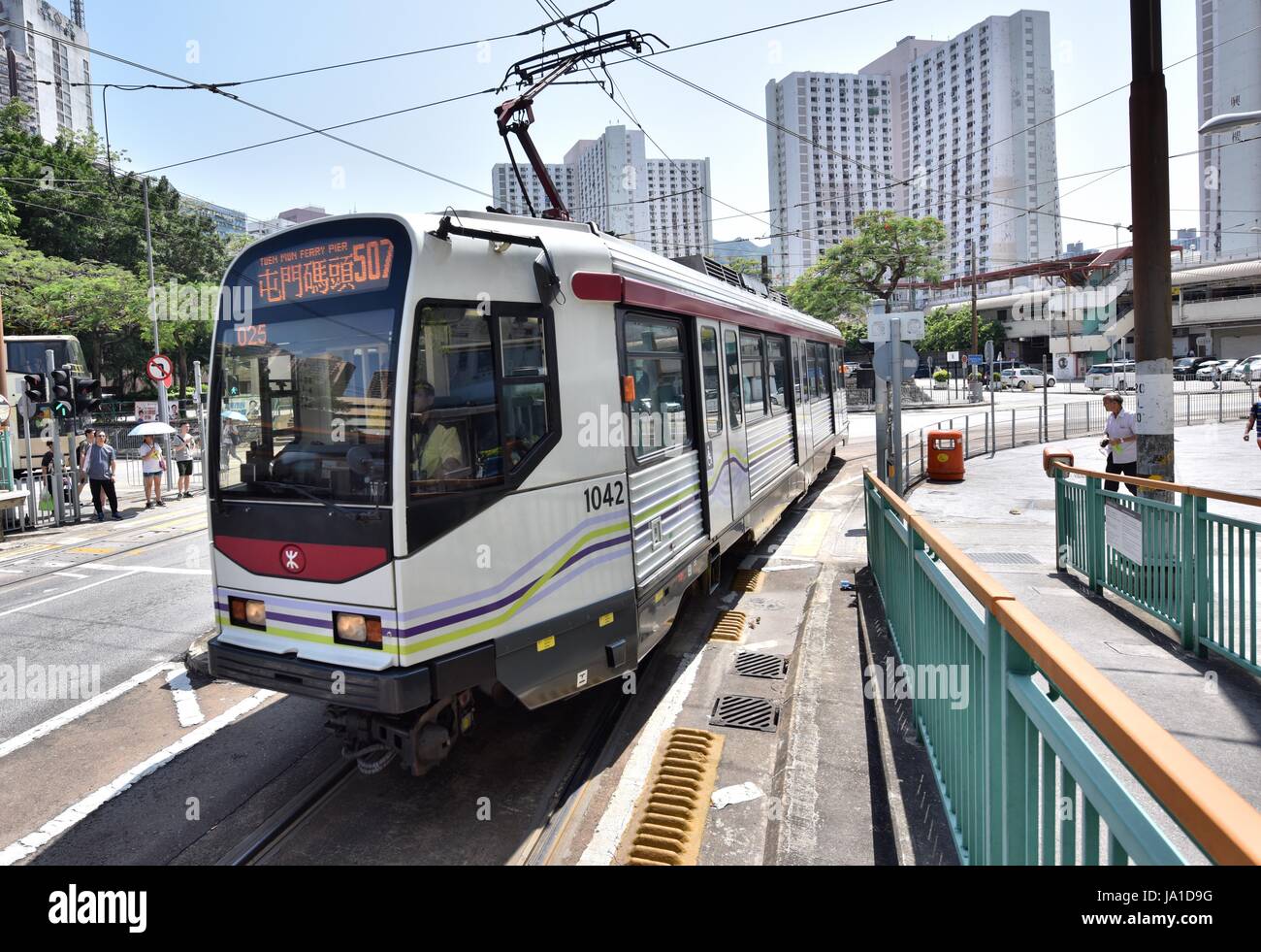 Hong Kong, China. 3rd June, 2017. A light rail train runs in Tin Shui ...