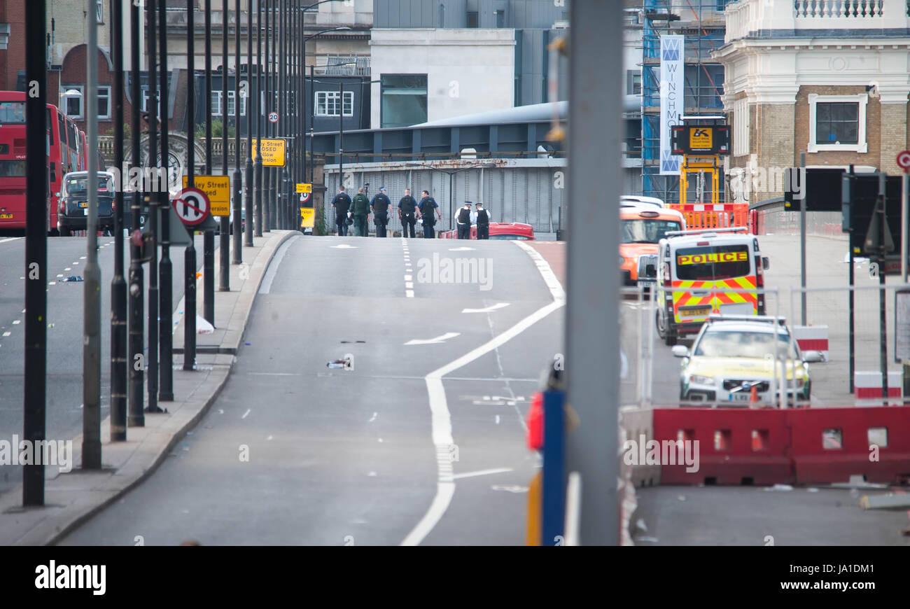 London, UK. 4th June, 2017. Police officers stands guard London Bridge ...