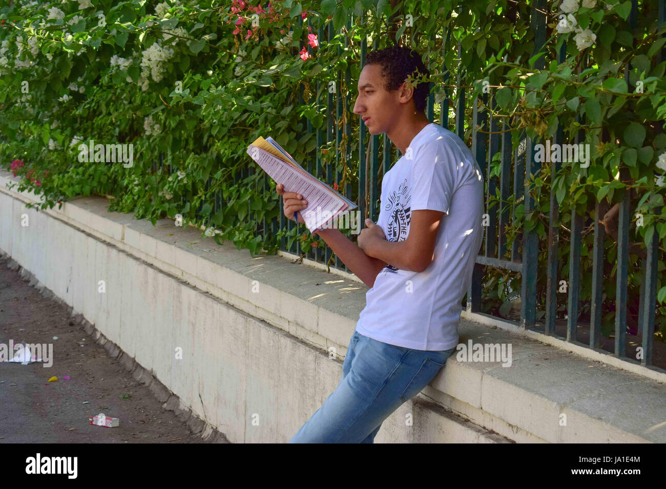 Cairo, Egypt. 4th June, 2017. An Egyptian student stands outside his ...