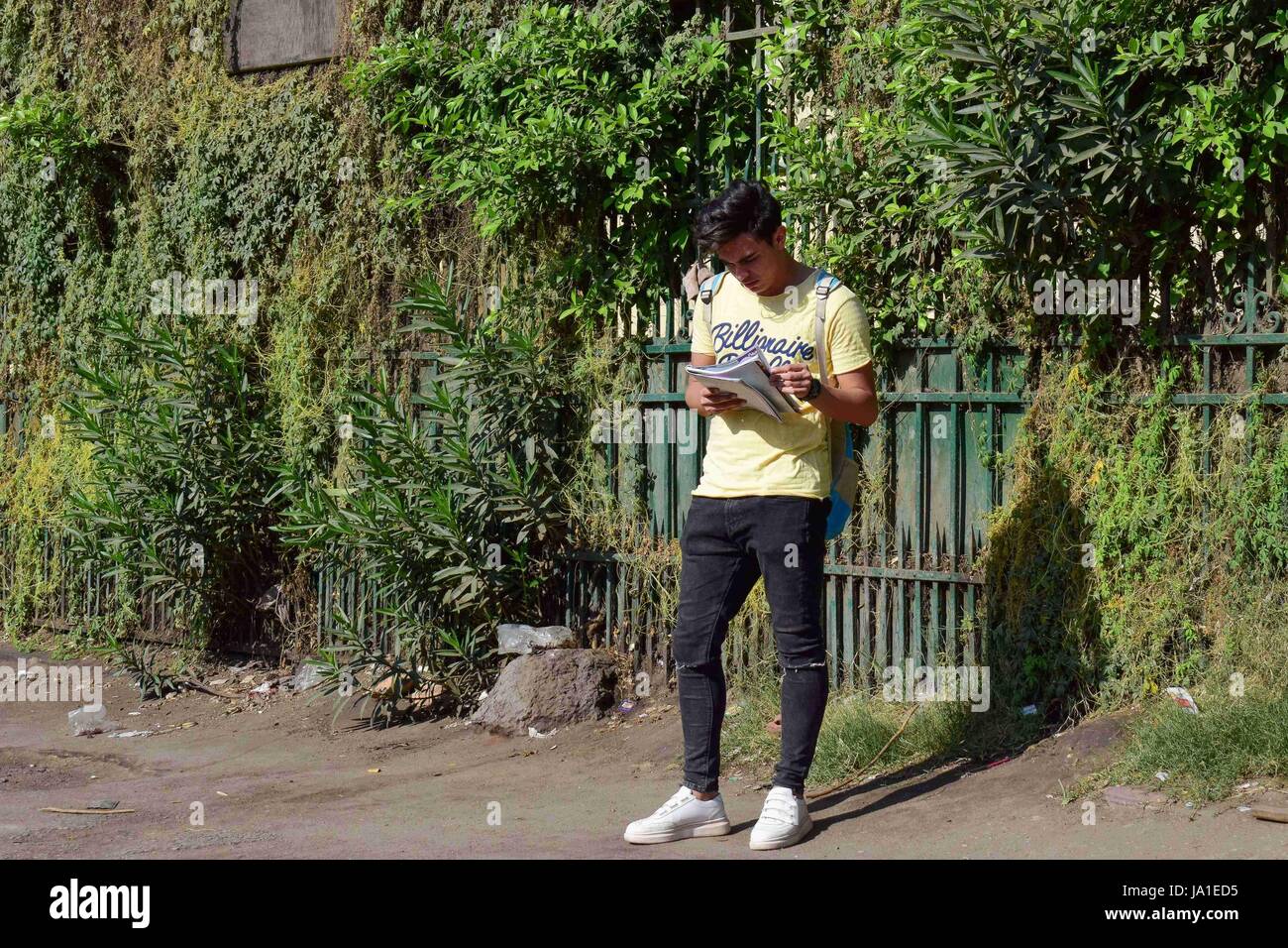 Cairo, Egypt. 4th June, 2017. An Egyptian student stand outside his ...