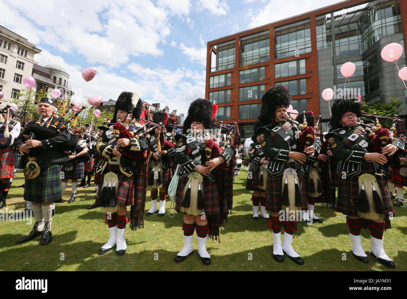 Manchester, UK. 04th June, 2017. Men and women members of pipe bands ...