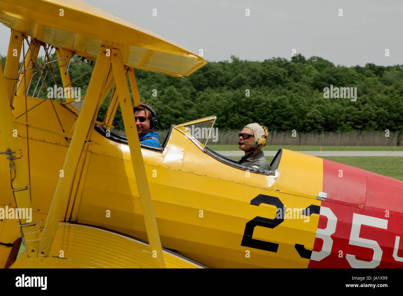 Stearman E-75N1 Biplane with pilot and passenger prepare for takeoff ...
