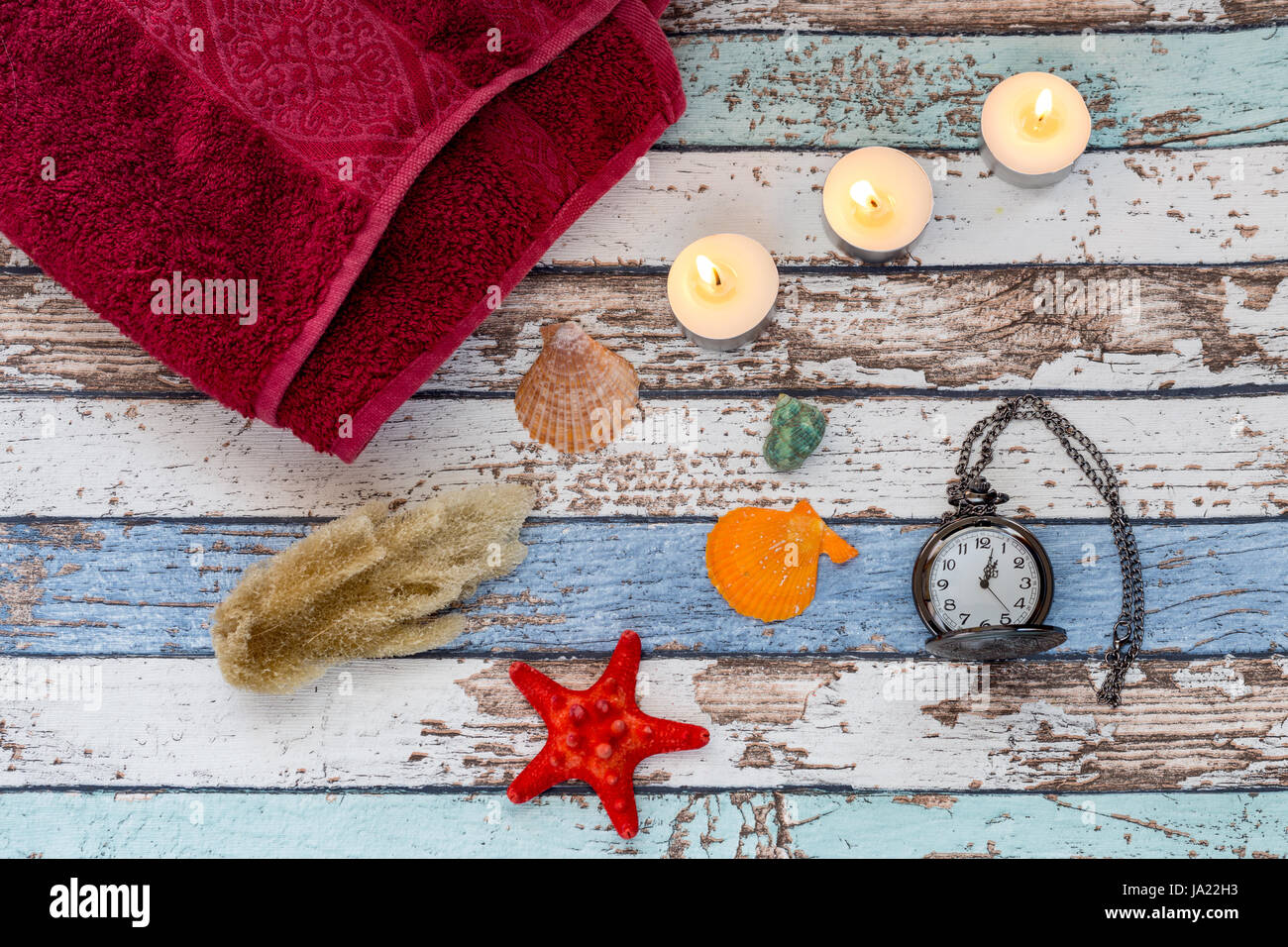Spa time in summer: Summer spa concept with seashells, towel, candles ...
