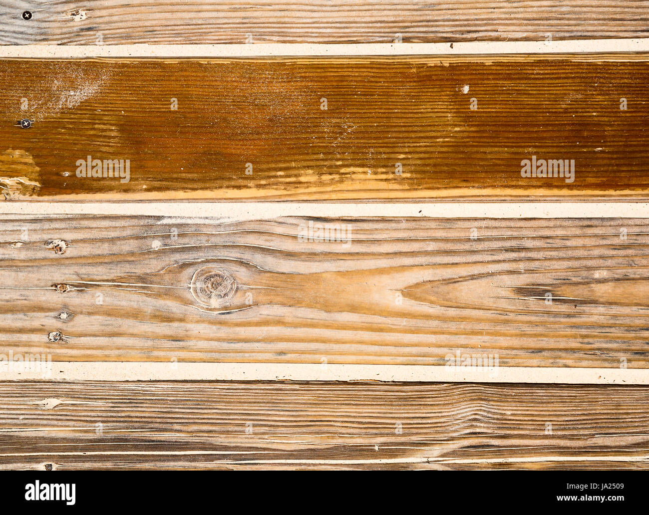 Brown wooden planks in the sand. Wood texture Stock Photo - Alamy