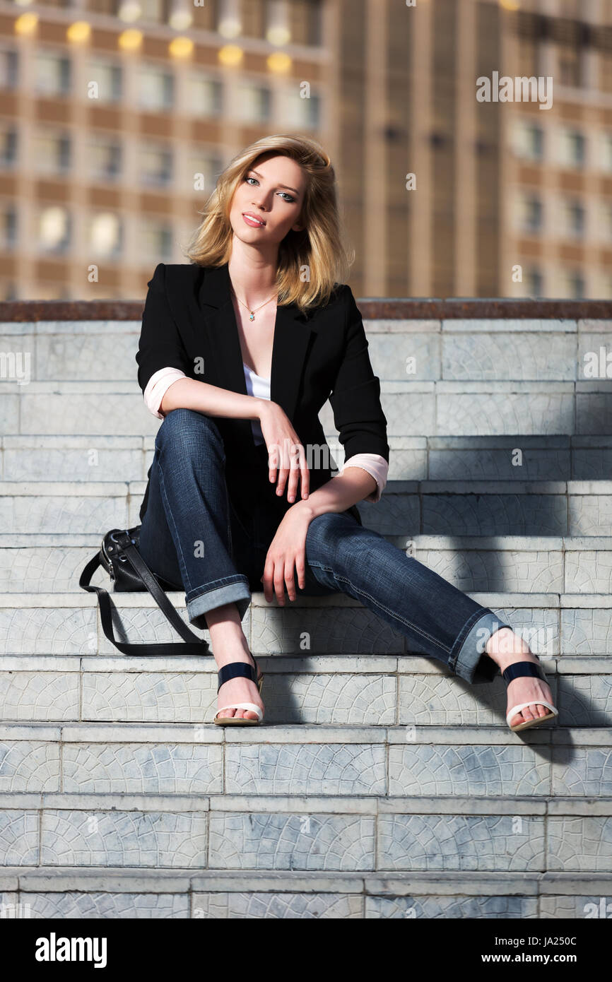 Woman sitting on steps business hi-res stock photography and images - Alamy