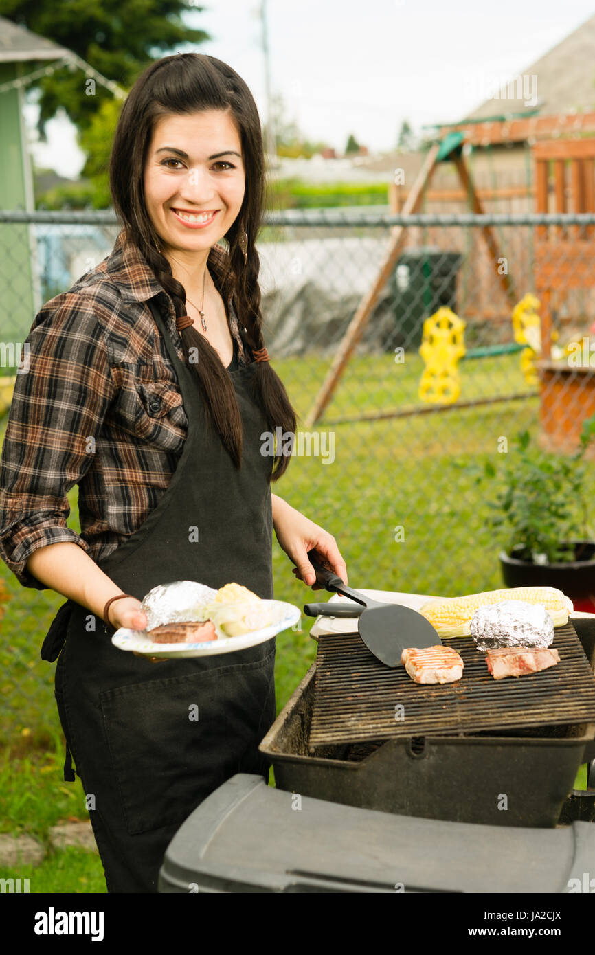 Pretty Woman Smiling Cooking Steaks Barbecue Backyard Food Grill Stock ...