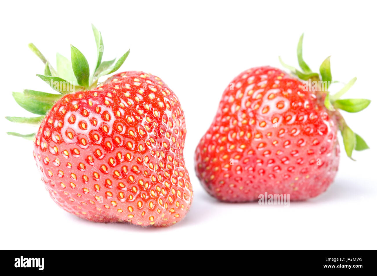 two strawberries isolated against white Stock Photo - Alamy