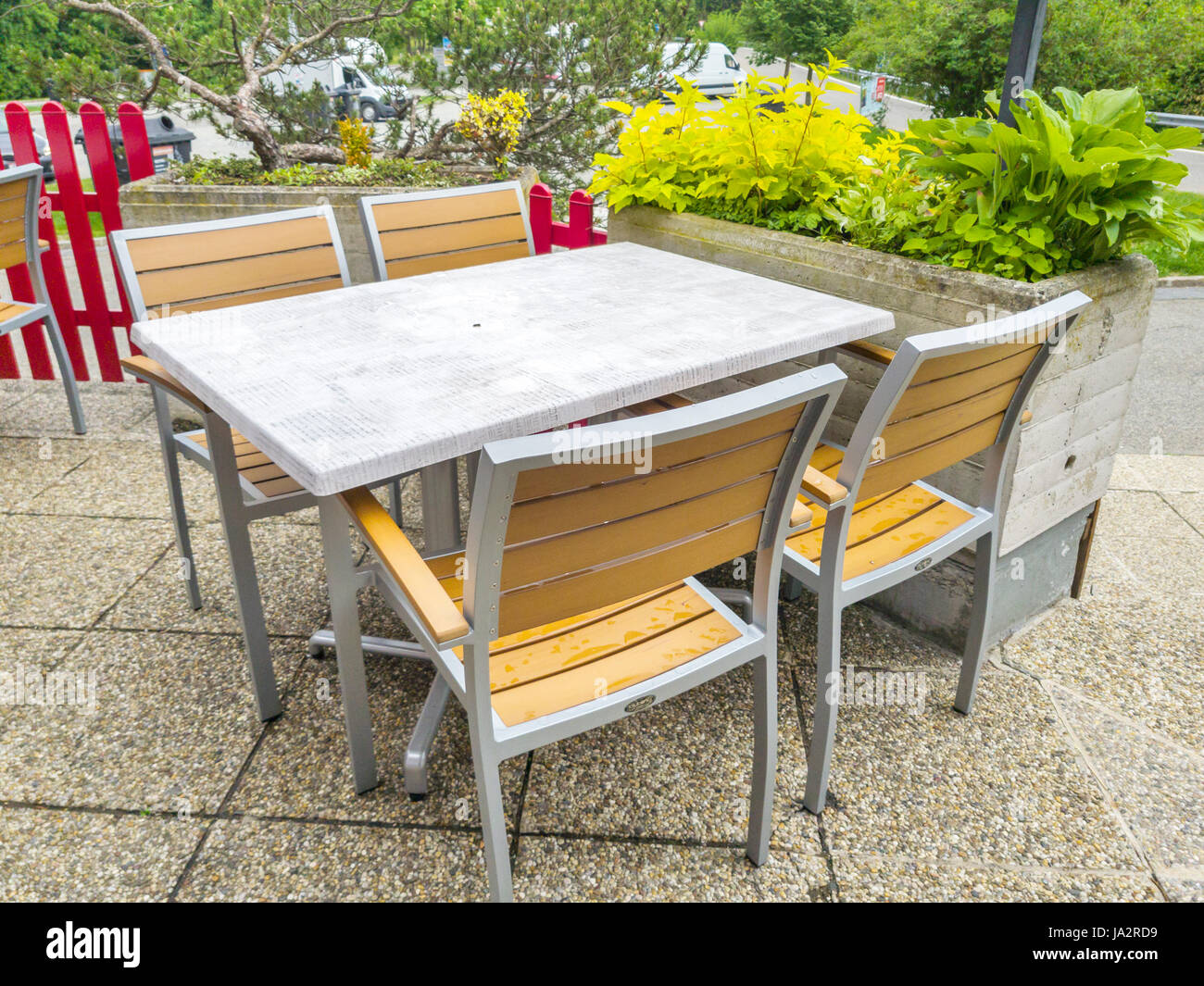 Wooden chair and table at restaurant outdoor Stock Photo - Alamy