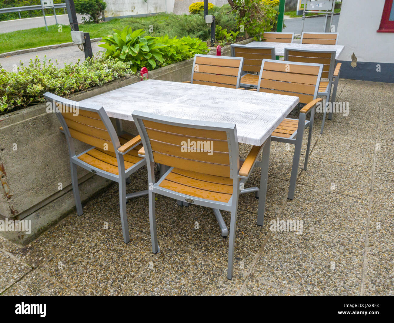 Wooden chair and table at restaurant outdoor Stock Photo - Alamy