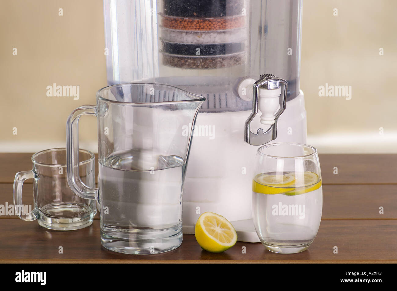 Filter system of water purifier with two glasses of water one filled ...