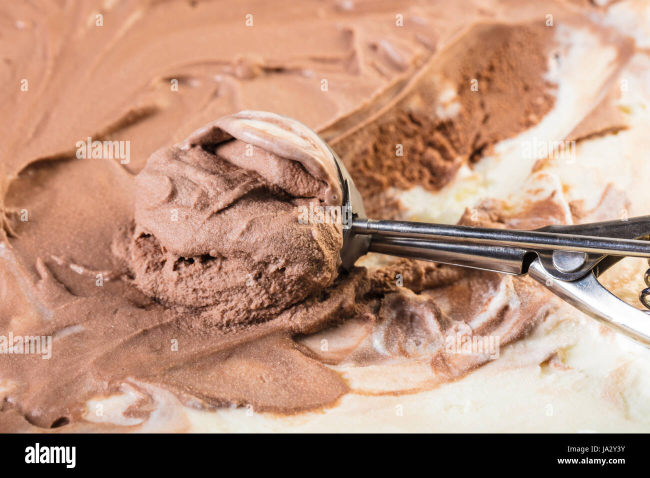 Spoon chocolate with vanilla ice cream closeup Stock Photo - Alamy