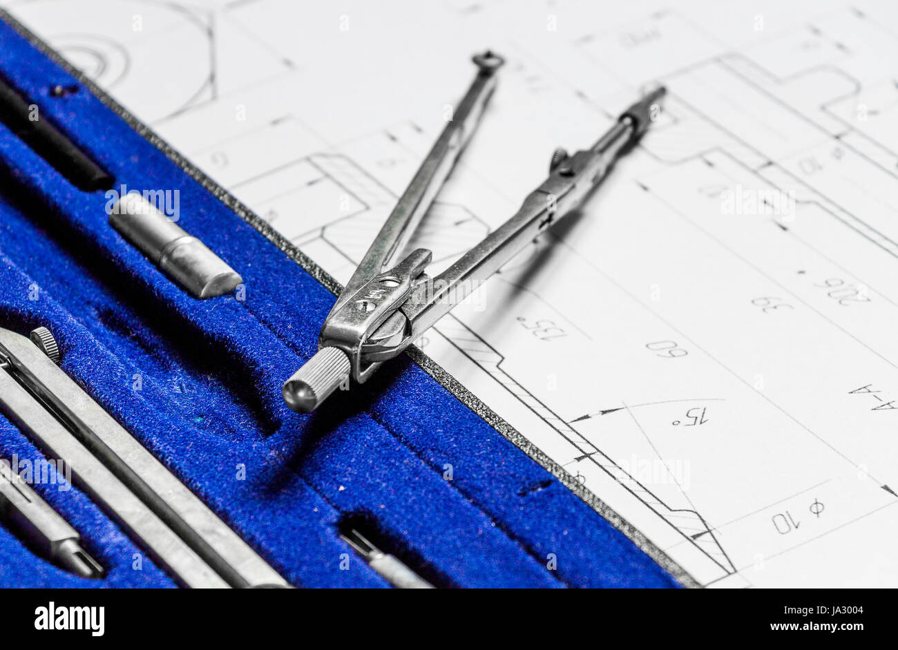 Lying drawing compasses closeup Stock Photo - Alamy