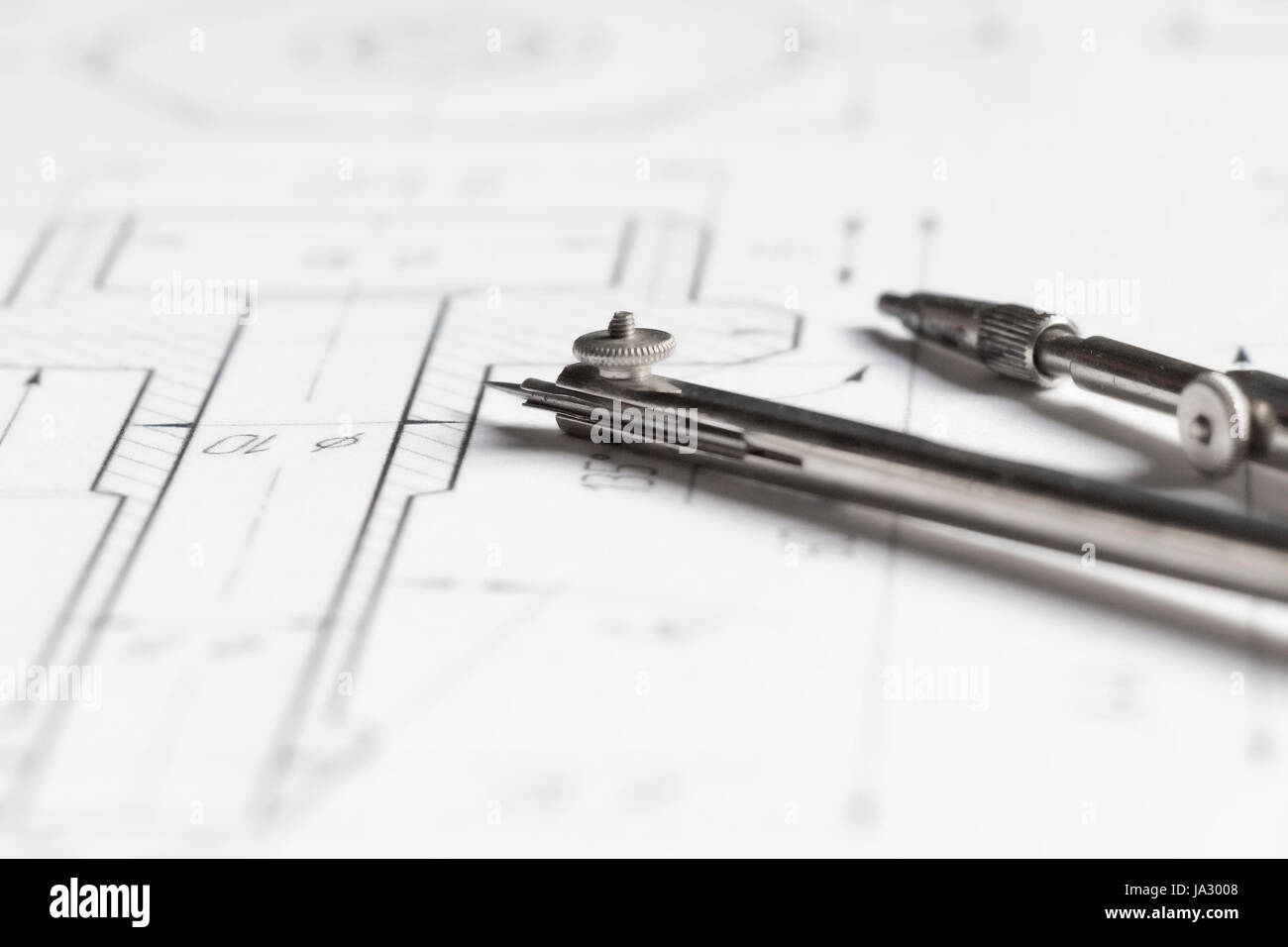 Lying drawing compasses closeup Stock Photo - Alamy