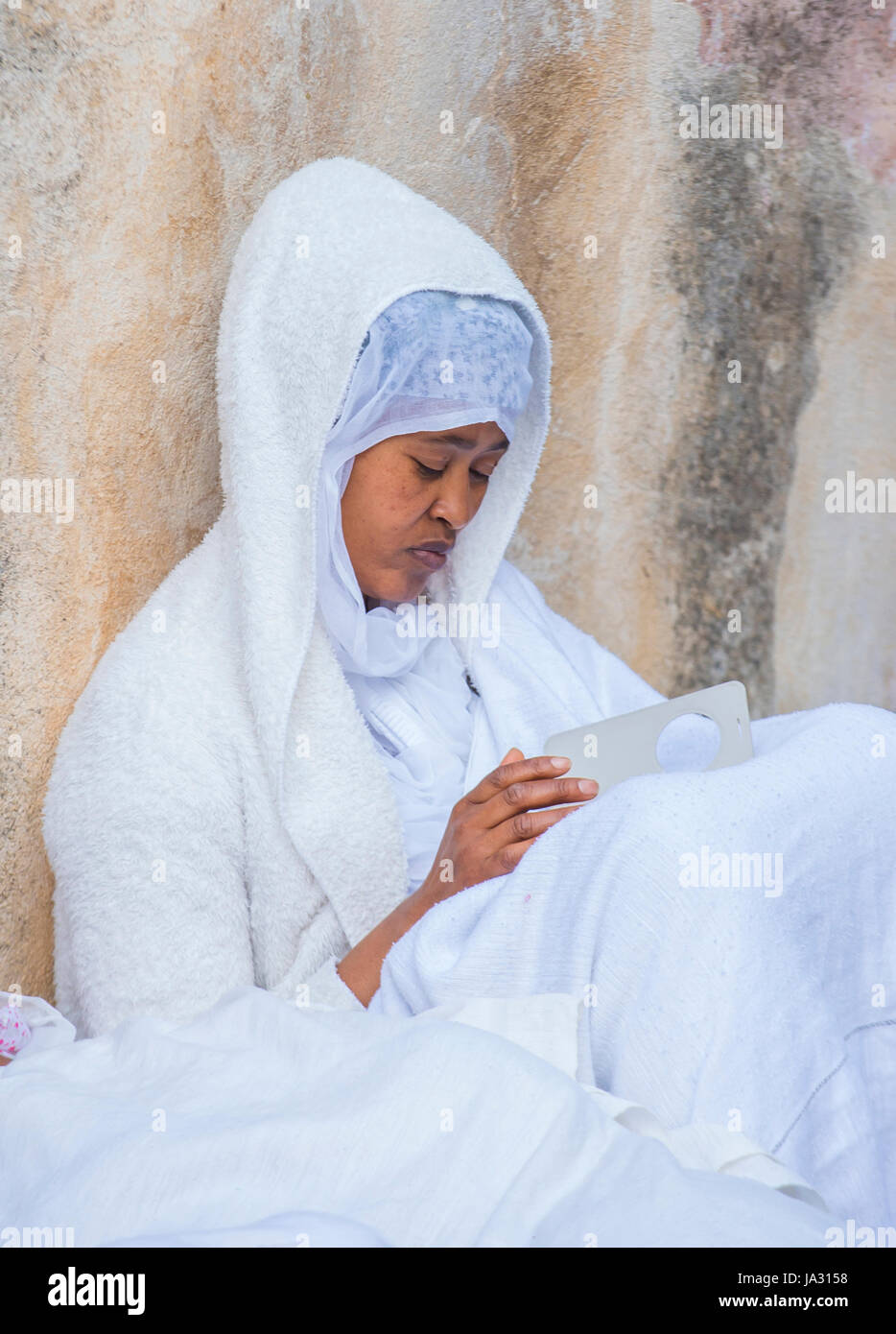 Ethiopian Orthodox pilgrim participates in the Holy fire ceremony at ...