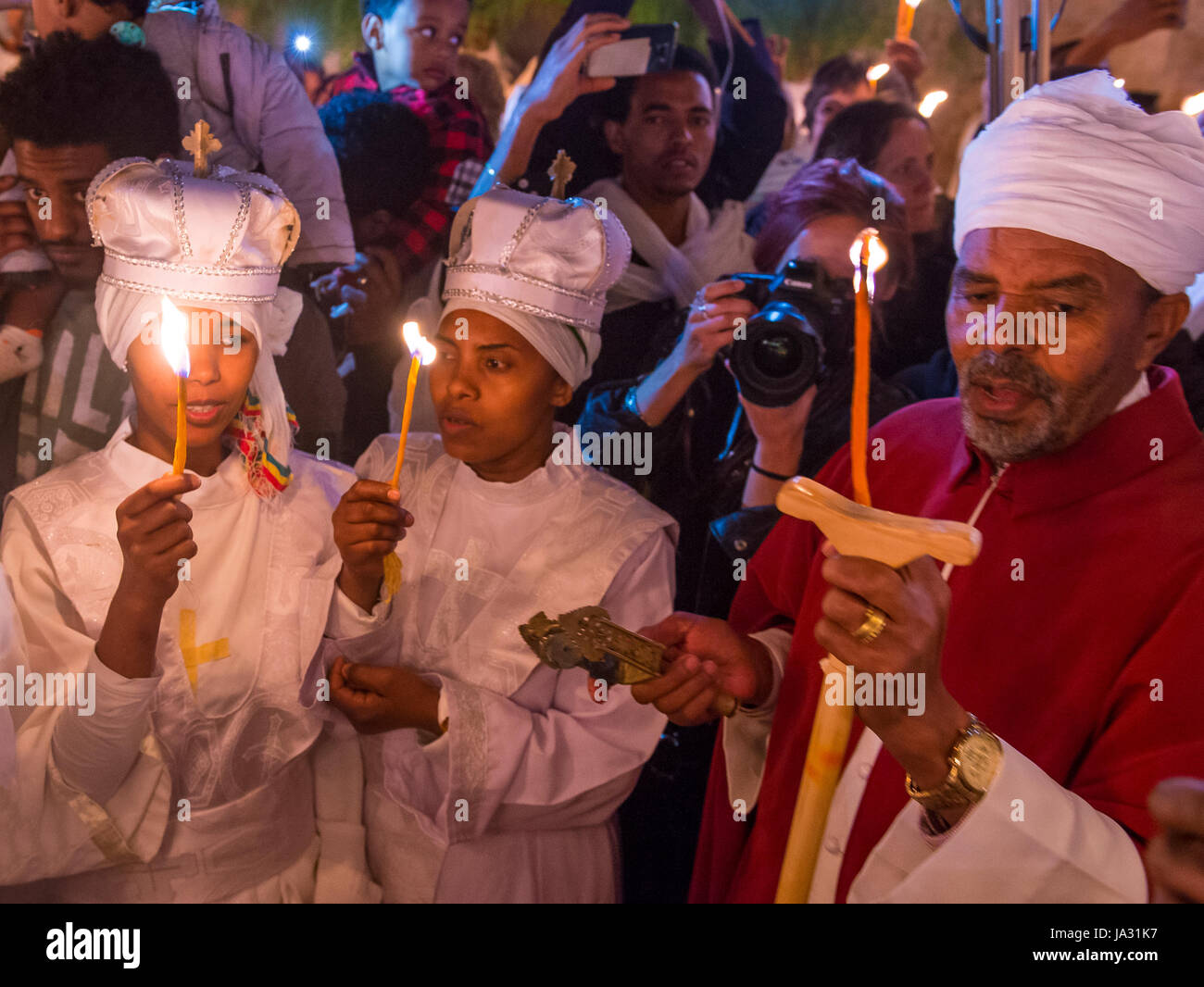 Ethiopian Orthodox pilgrims participates in the Holy fire ceremony at ...