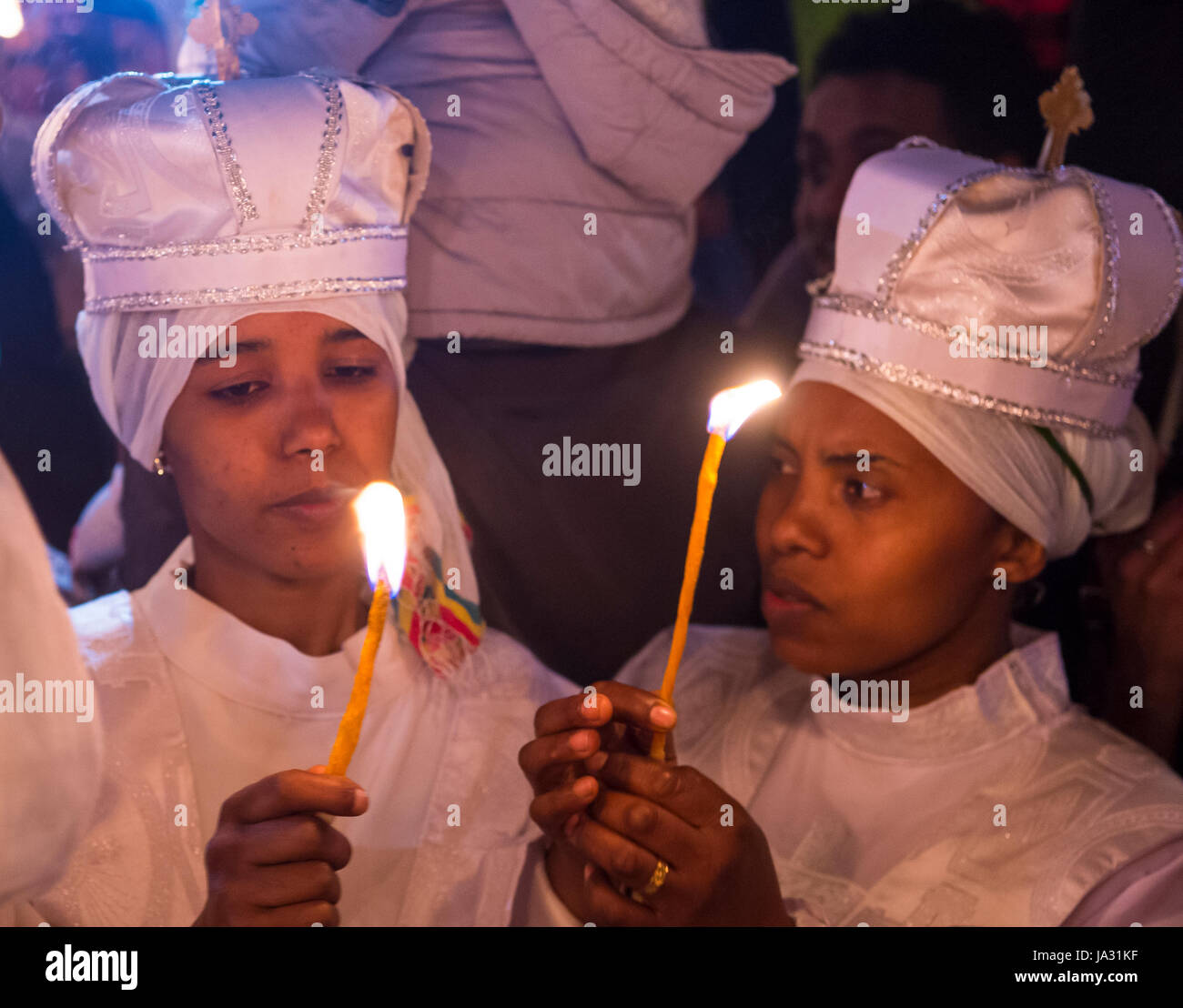 Ethiopian Orthodox pilgrim participates in the Holy fire ceremony at ...