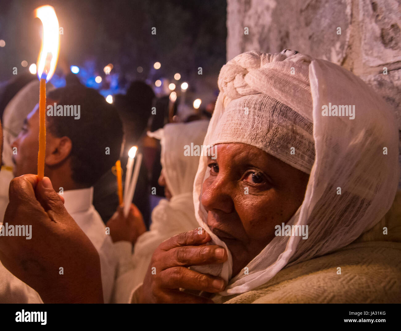 Ethiopian Orthodox pilgrim participates in the Holy fire ceremony at ...