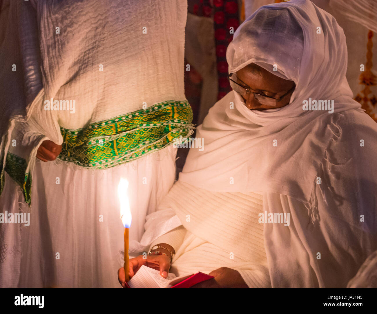 Ethiopian Orthodox pilgrim participates in the Holy fire ceremony at ...