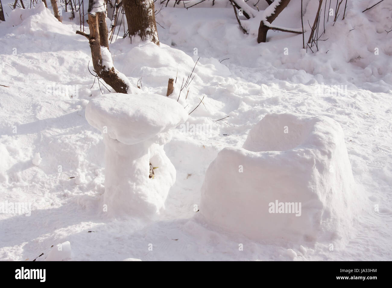 Figures from the snow on the playground Stock Photo - Alamy