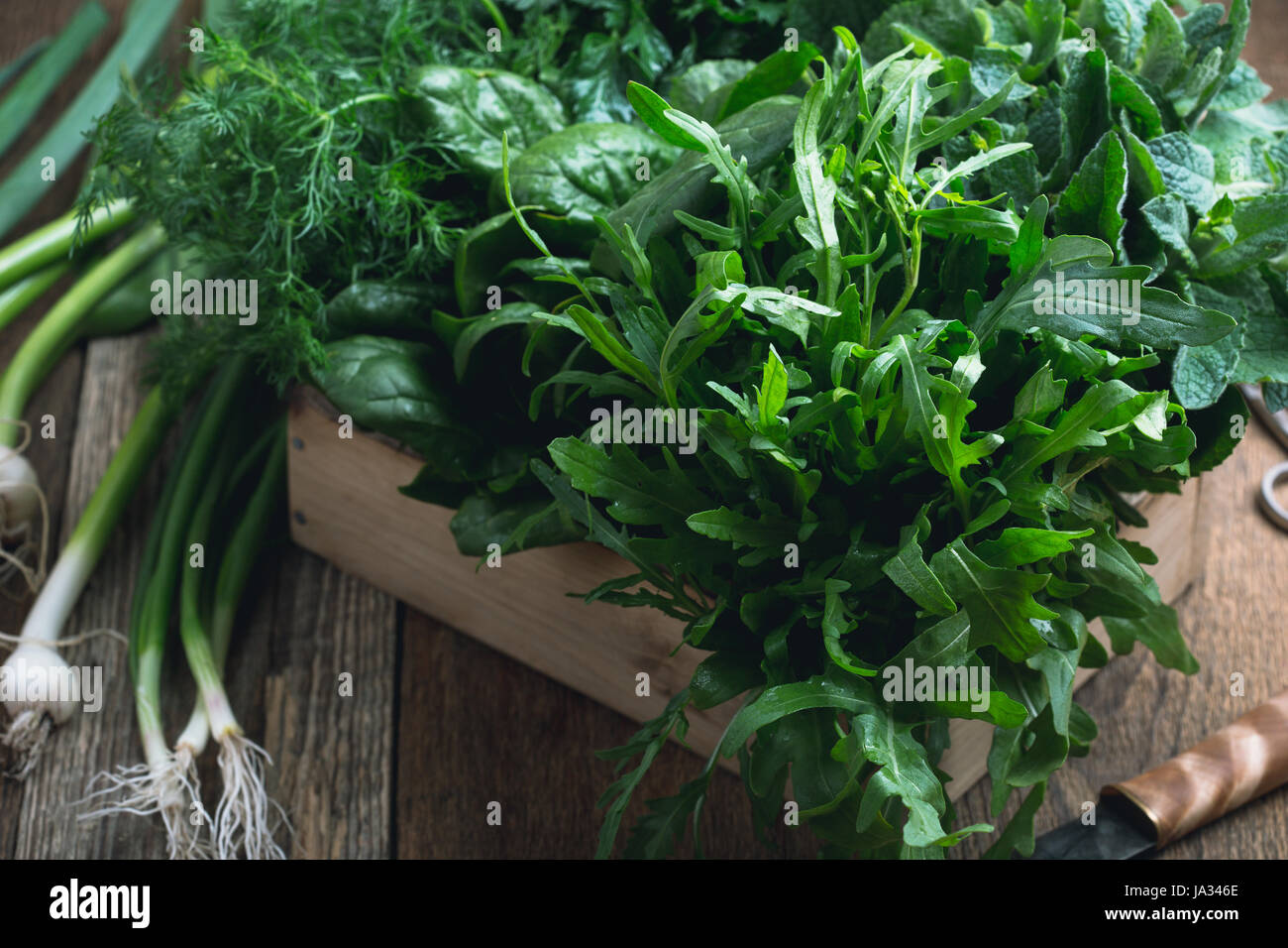 Organic fresh herbs in crate on wooden background, harvest time Stock ...