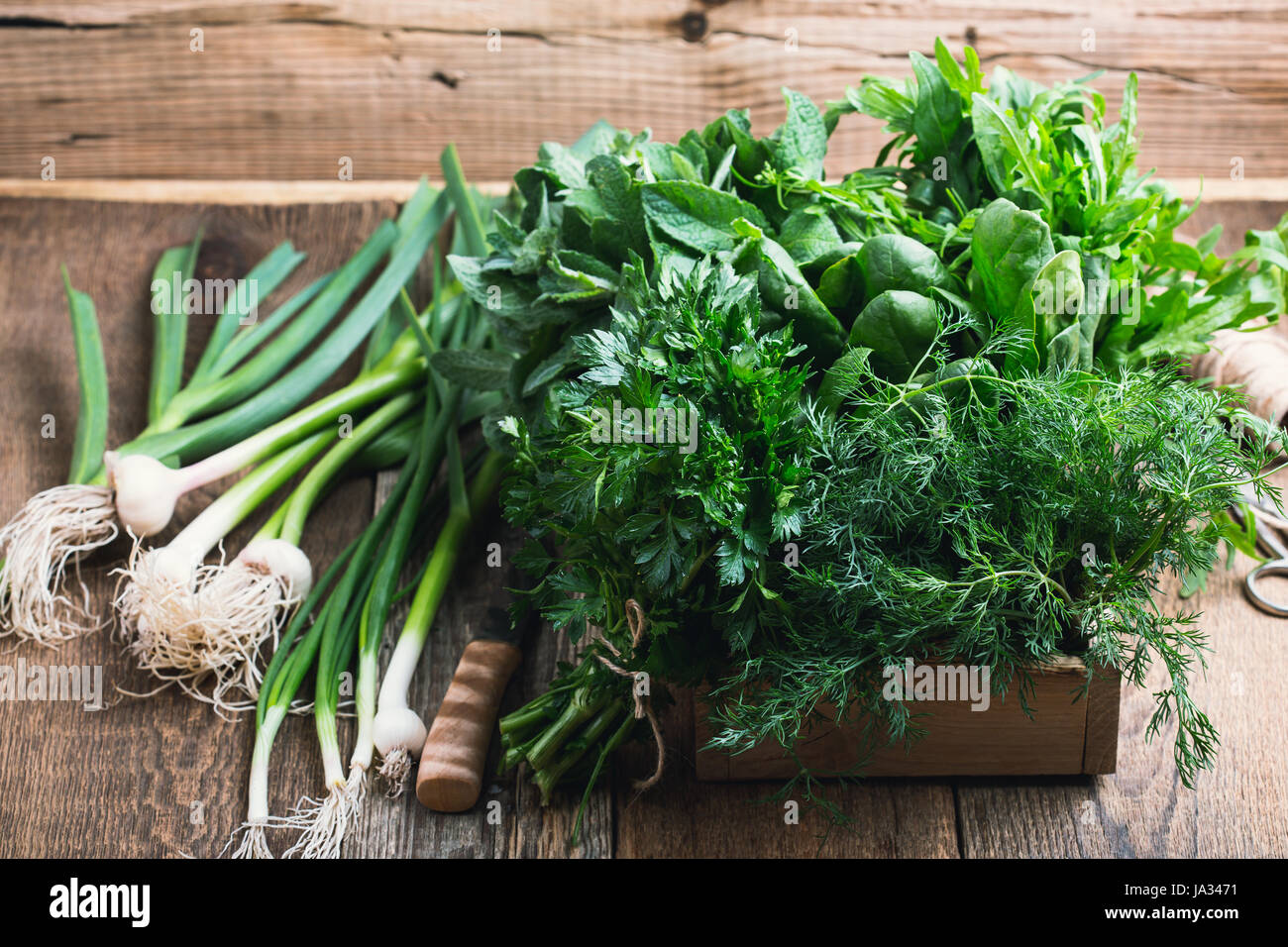 Organic fresh herbs in crate on wooden background, harvest time Stock ...