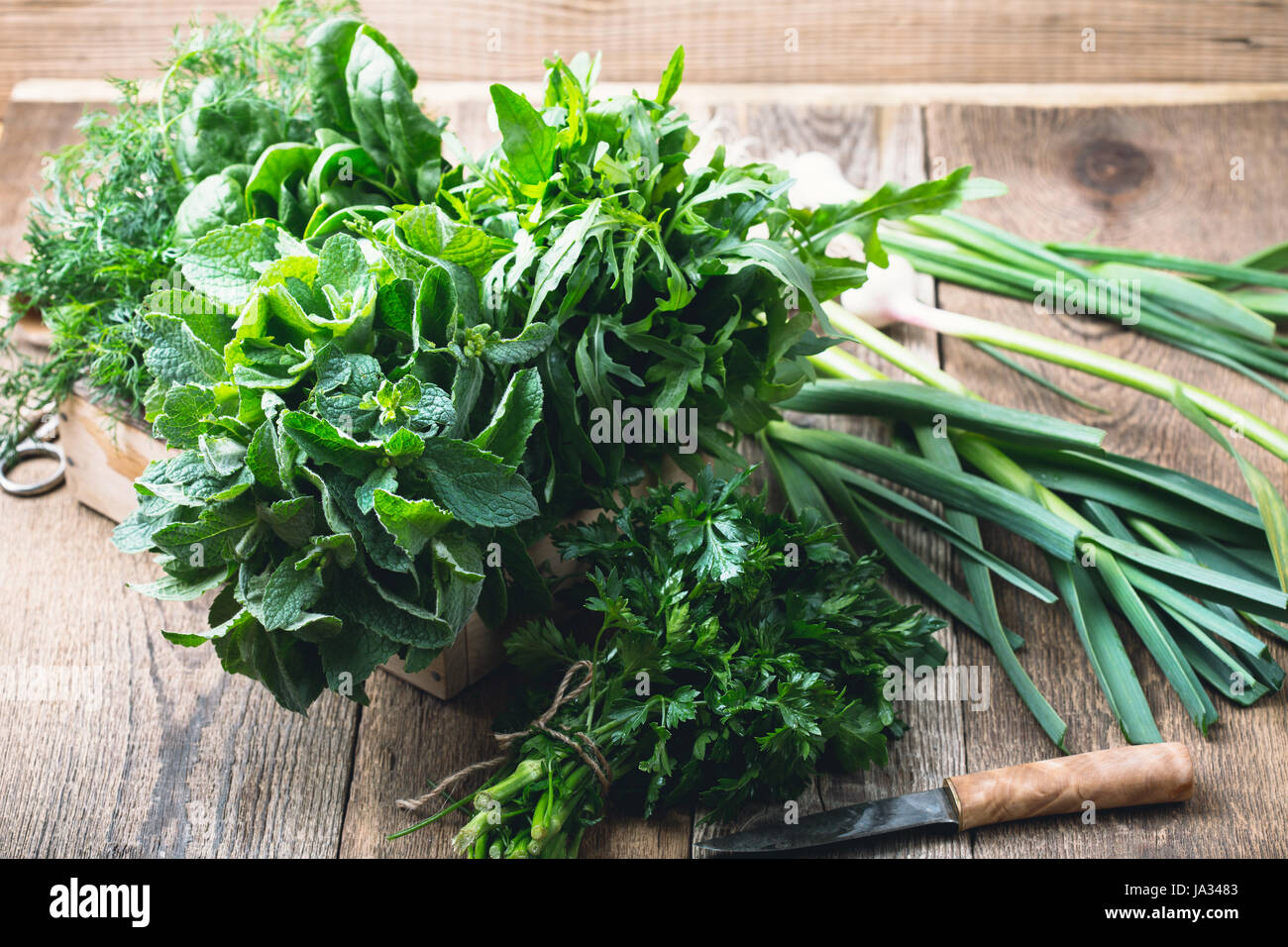Organic fresh herbs in crate on wooden background, harvest time Stock ...